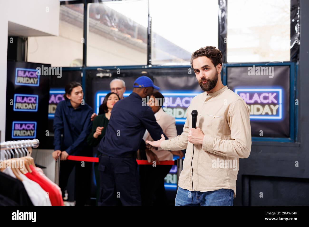 Journalist holding mic gesturing while doing Black Friday reportage in ...