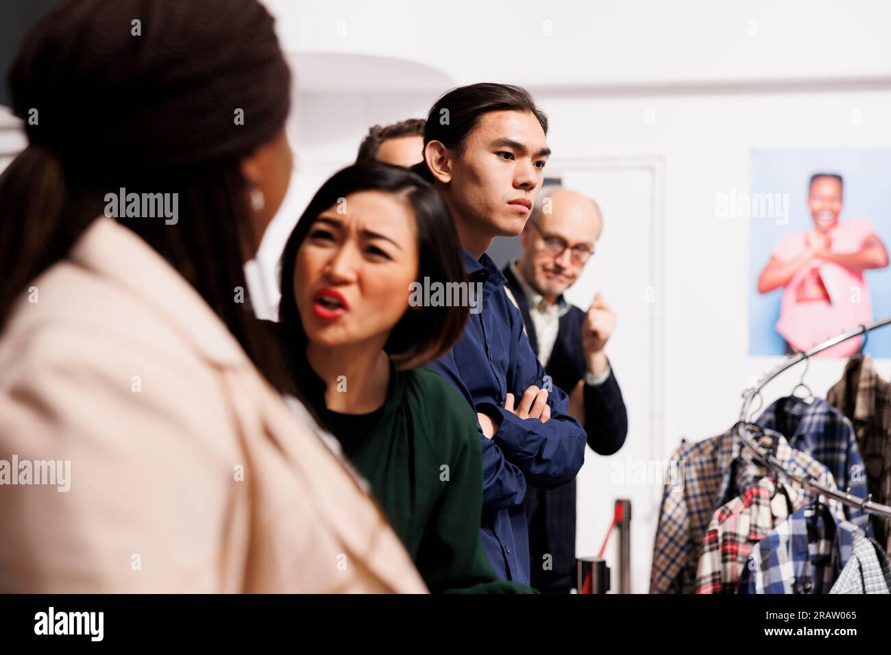 Angry rude diverse shoppers arguing while waiting in line at fashion ...
