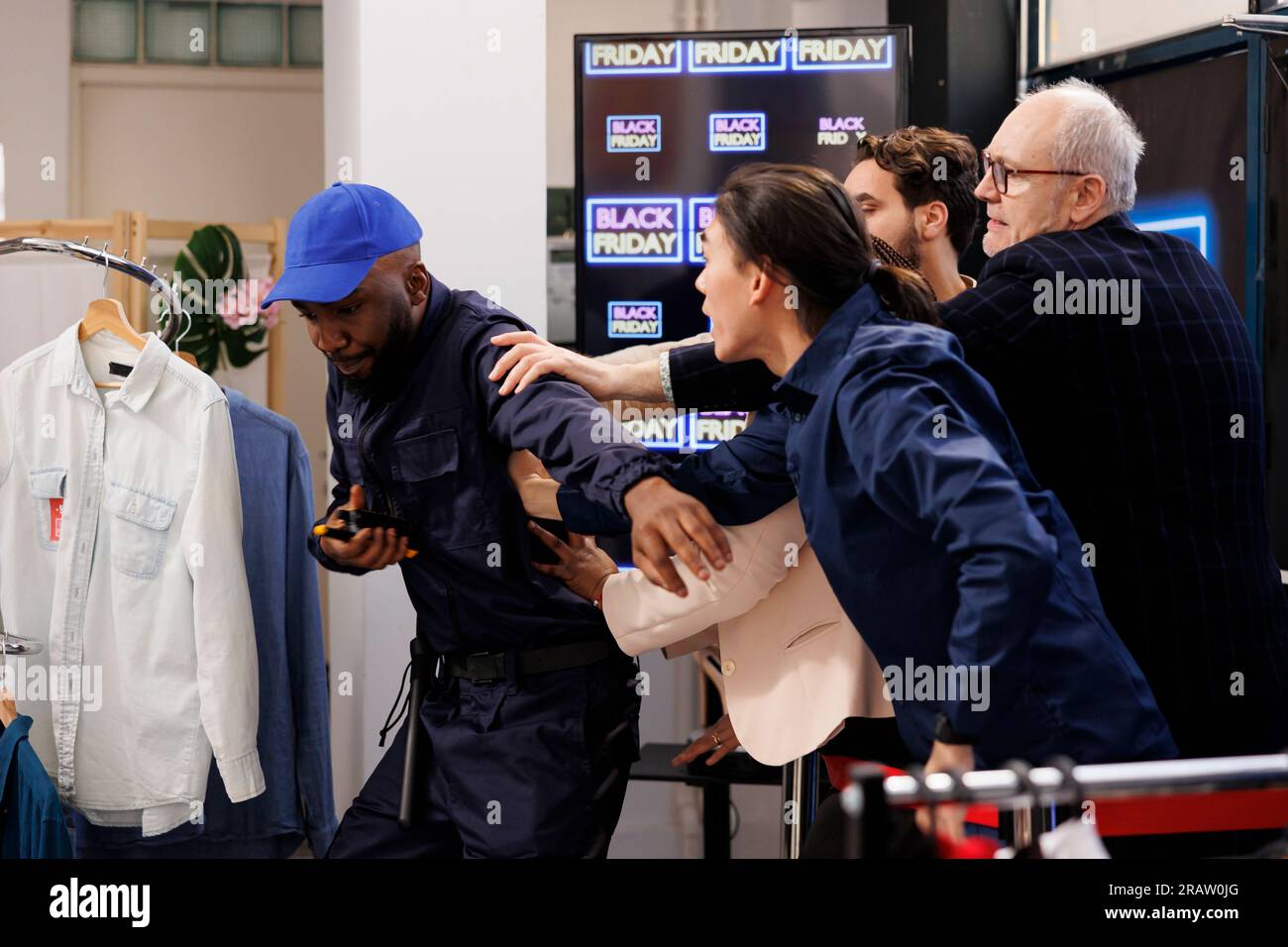 Impatient crowd of shoppers fighting with retail store staff, pushing ...