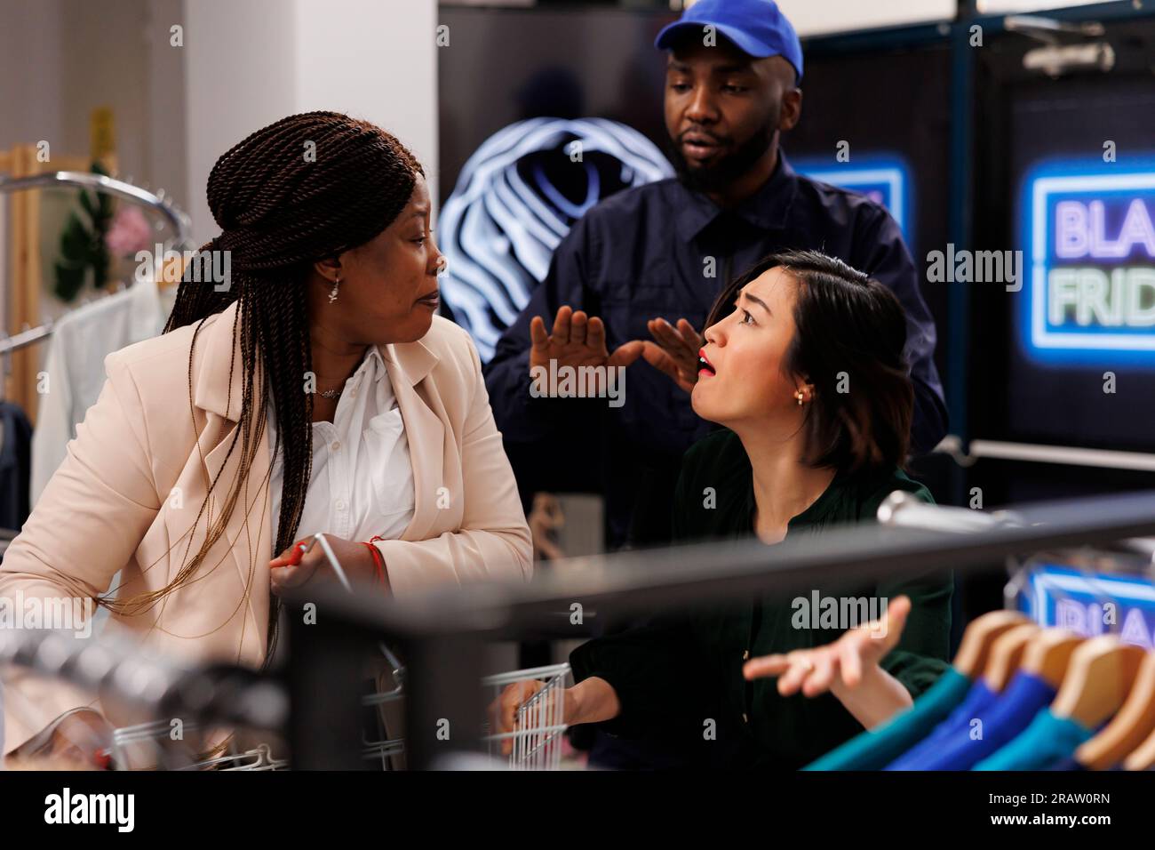 Two diverse women fighting over discount items during Black Friday ...