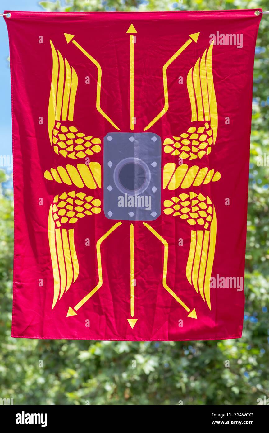 vertical view of a banner in red color with the symbol of an ancient ...