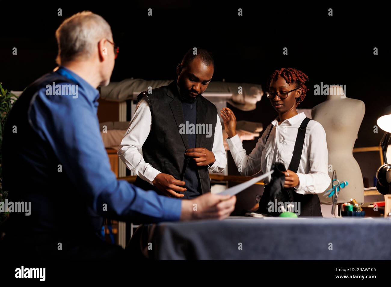 Expert Tailors Working On Comissioned Custom Made Wedding Suit For