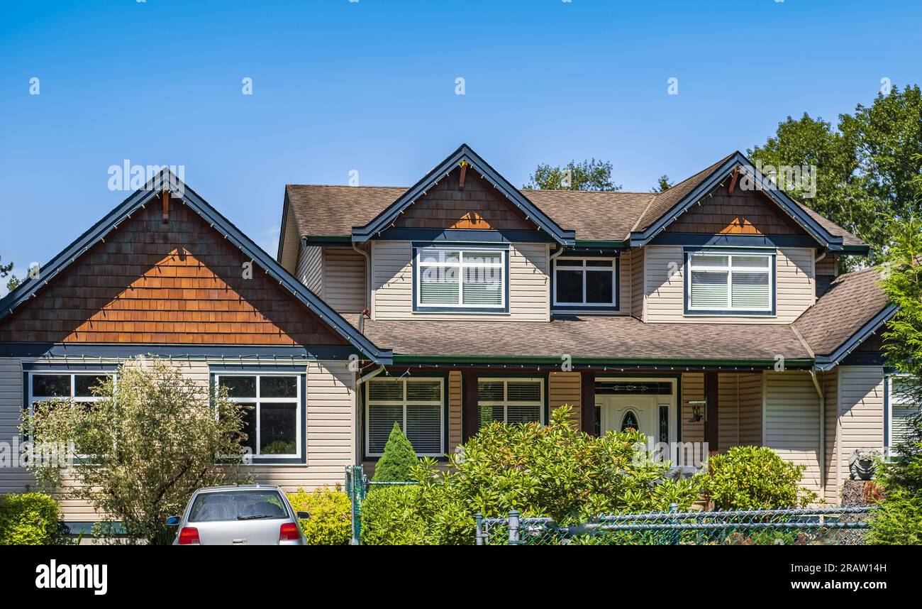 Real Estate Exterior Front House on a sunny day. Big custom made luxury ...
