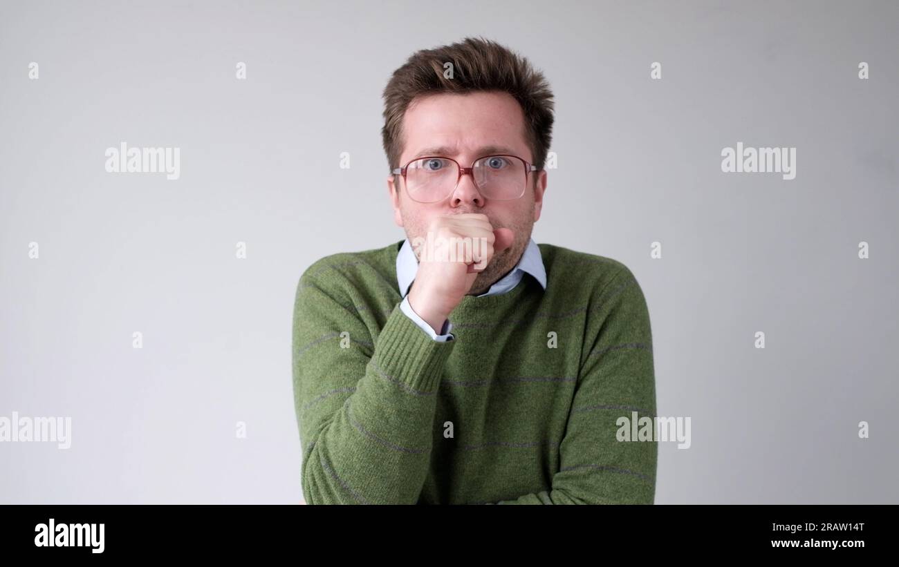 The angry European young man wearily looks. He is without strength and ...