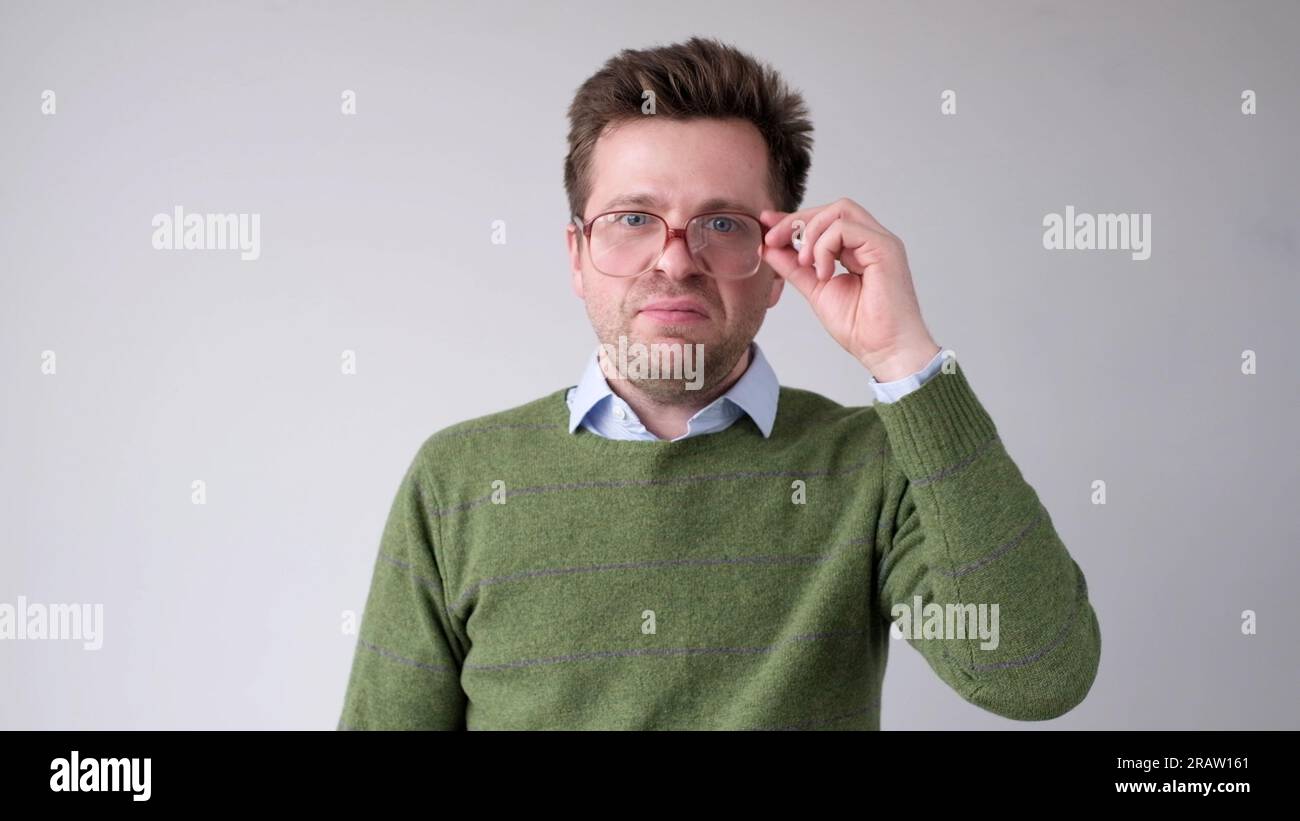 The angry European young man wearily looks. He is without strength and ...