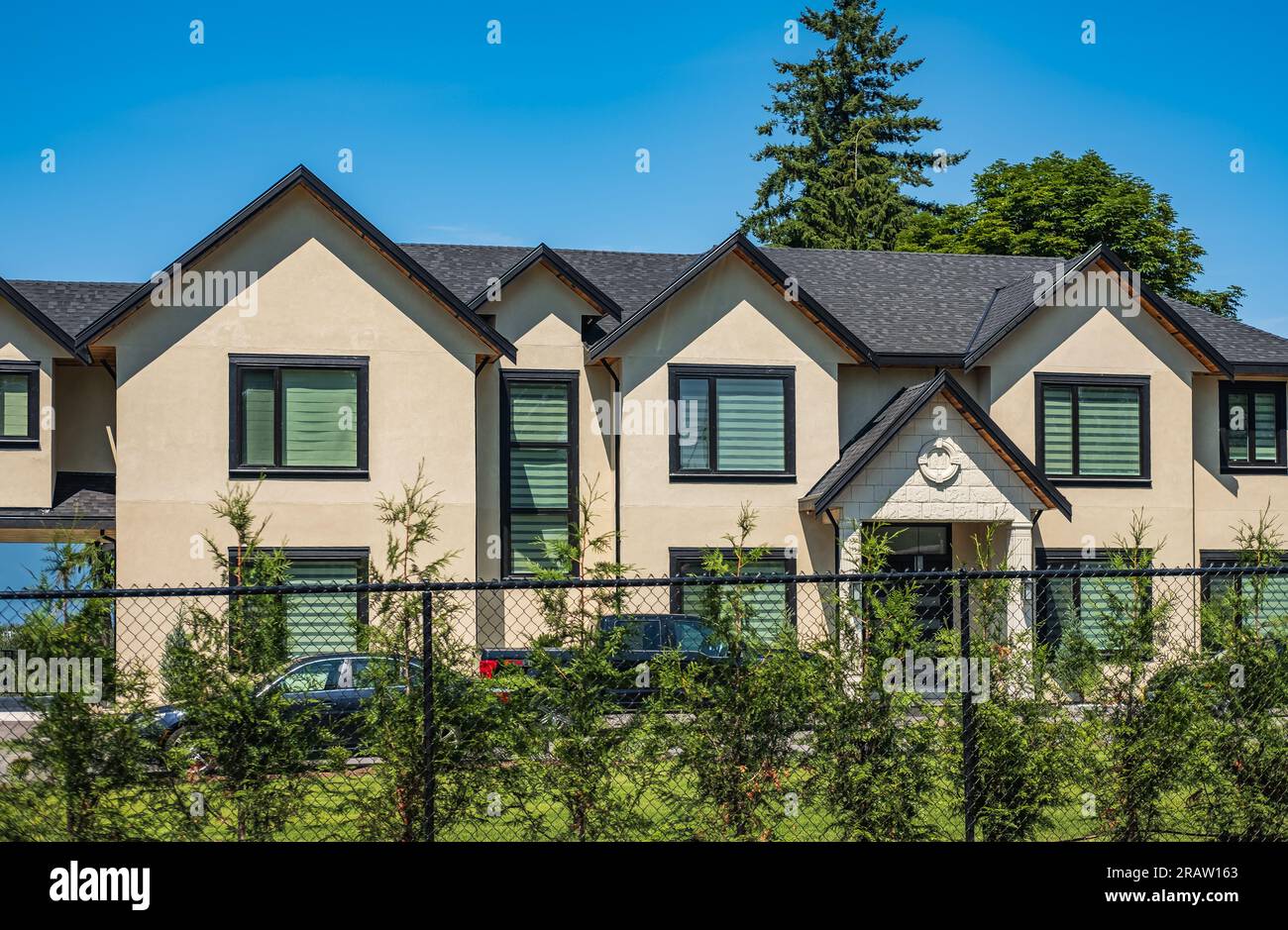 Real Estate Exterior Front House on a sunny day. Big custom made luxury ...