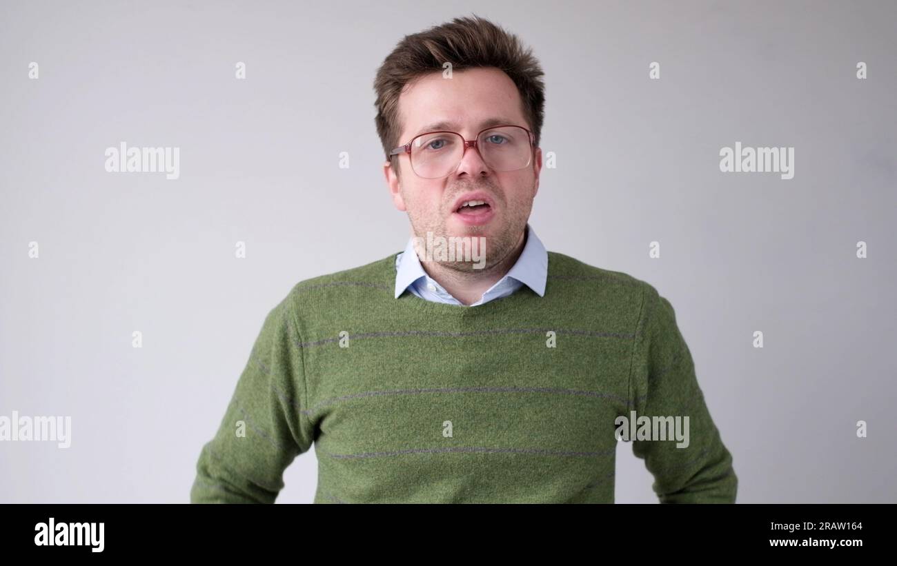 The angry European young man wearily looks. He is without strength and ...