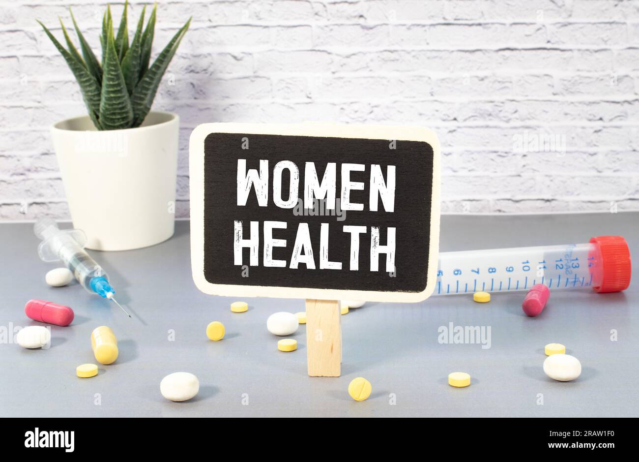 White card with the inscription WOMEN HEALTH on a medical protective ...