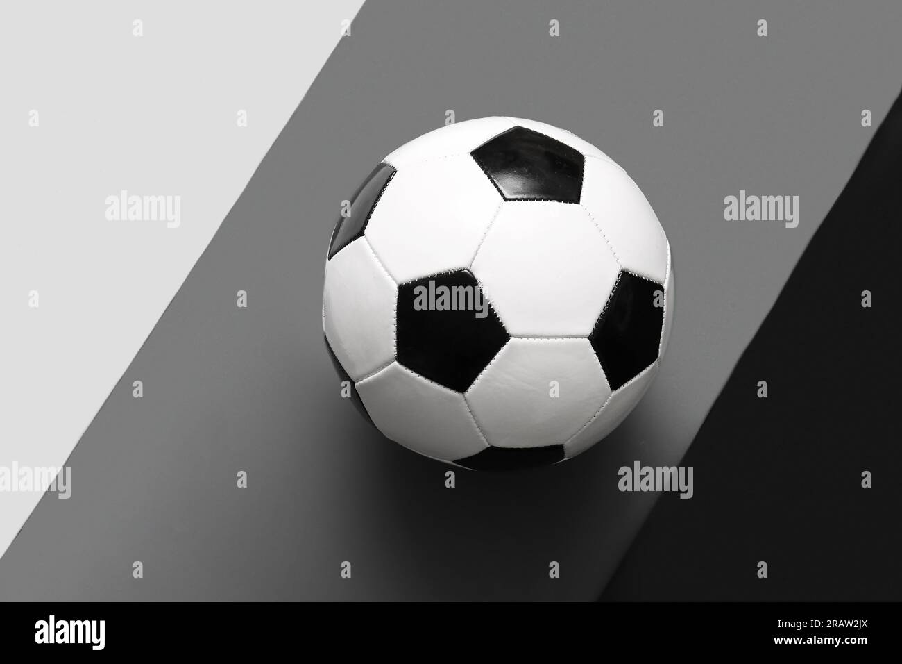 Soccer ball on grey background Stock Photo - Alamy
