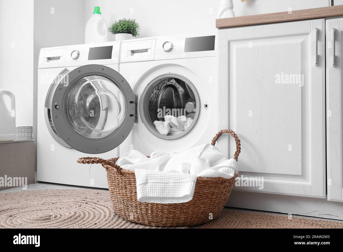 Modern washing machines with dirty clothes in laundry room Stock Photo ...