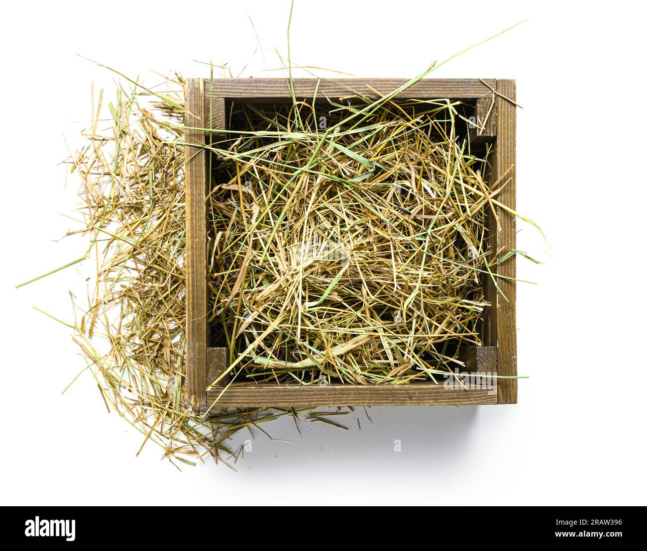 Straw in crate on white background Stock Photo - Alamy