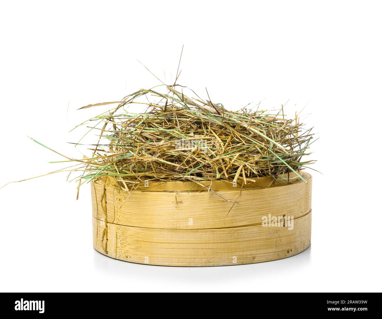 Straw in crate on white background Stock Photo - Alamy