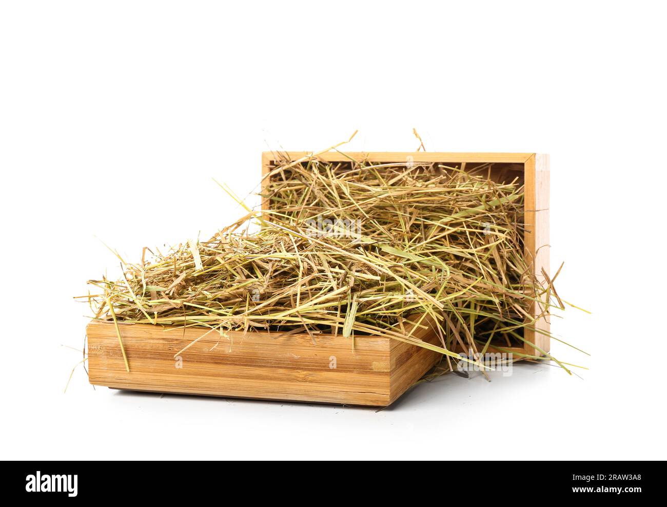 Straw in crates on white background Stock Photo - Alamy