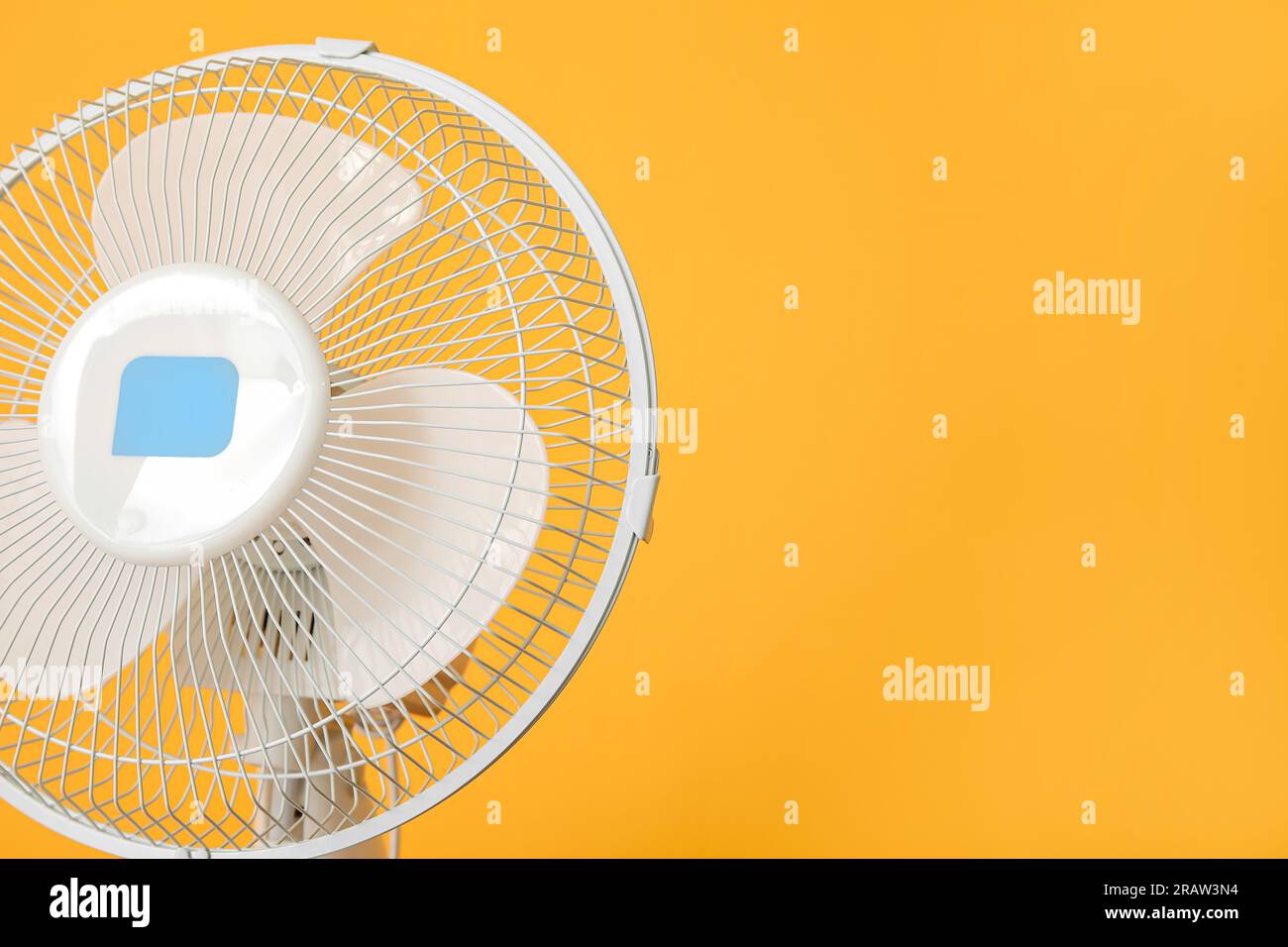 Modern electric fan on orange background Stock Photo - Alamy