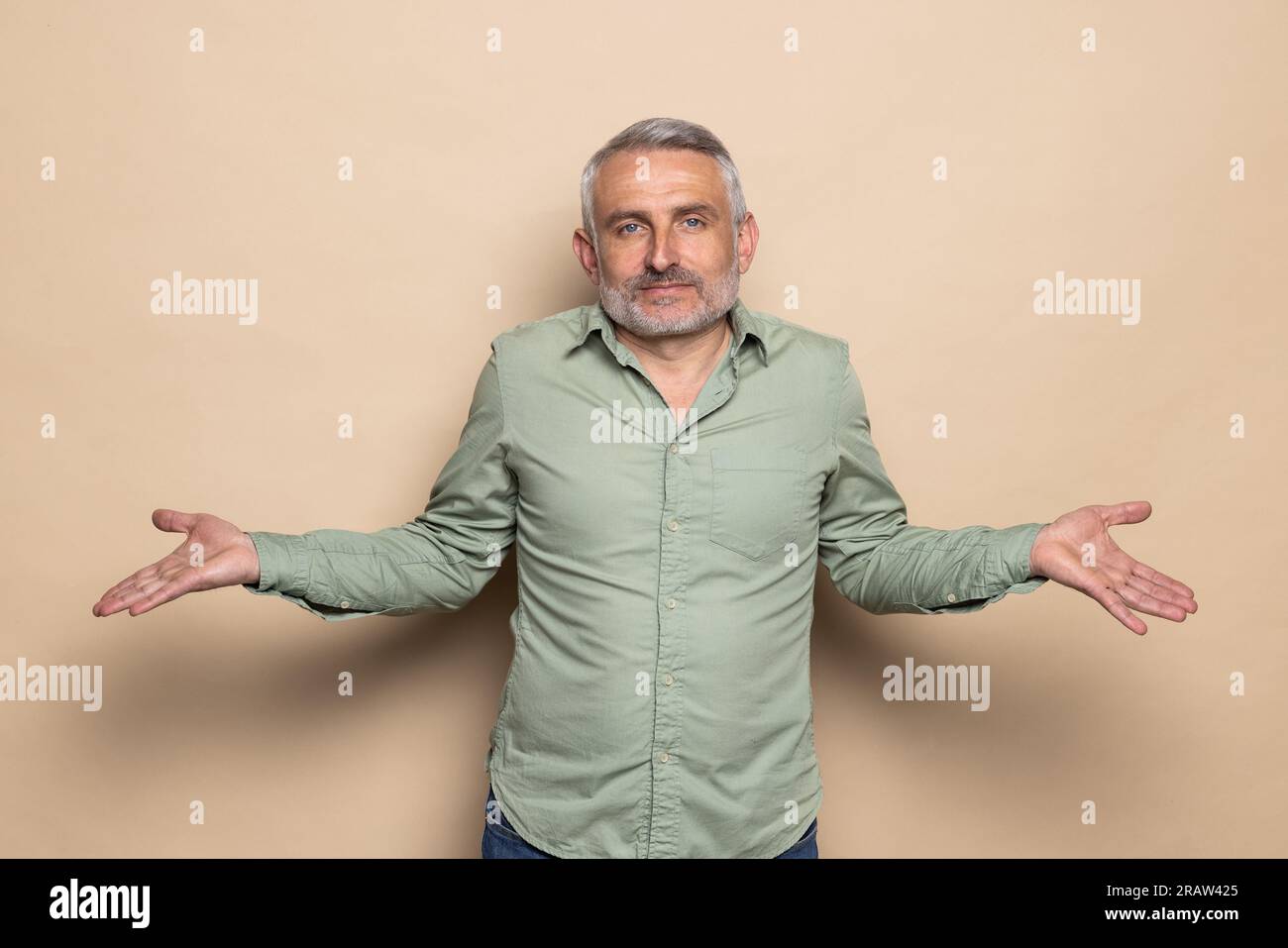 What Why. Sincere irritated man raising hands in indignant expression ...