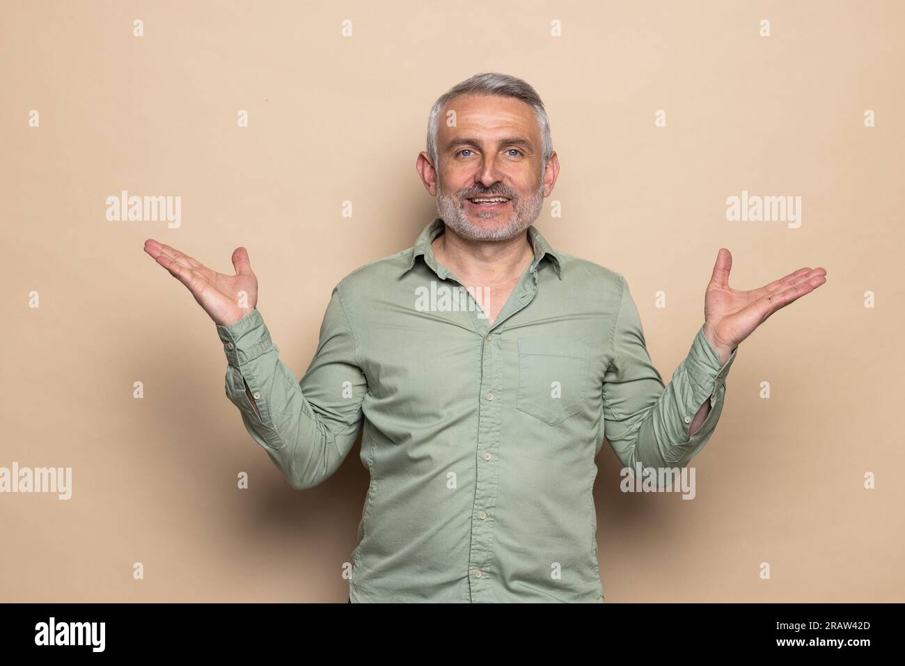 Elderly confused man shrugging shoulders looking puzzled spread hands ...