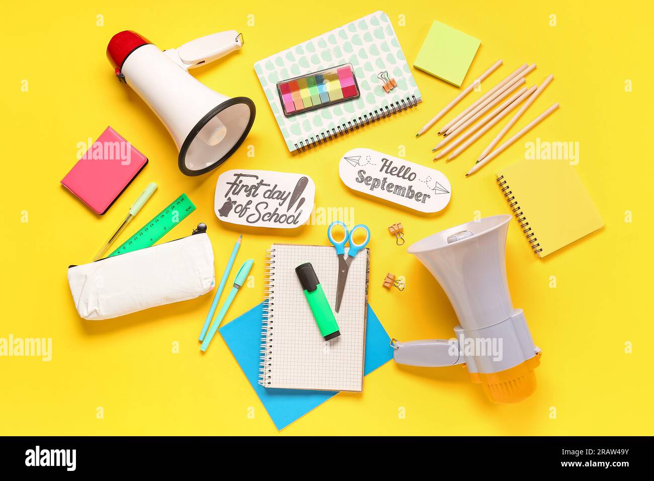Stationery, megaphone, sheets with text HELLO SEPTEMBER and FIRST DAY ...