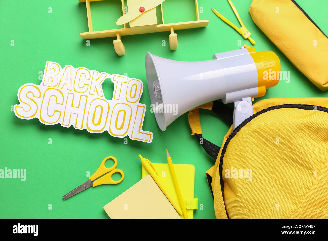 Backpack, stationery and megaphone with paper text BACK TO SCHOOL on ...