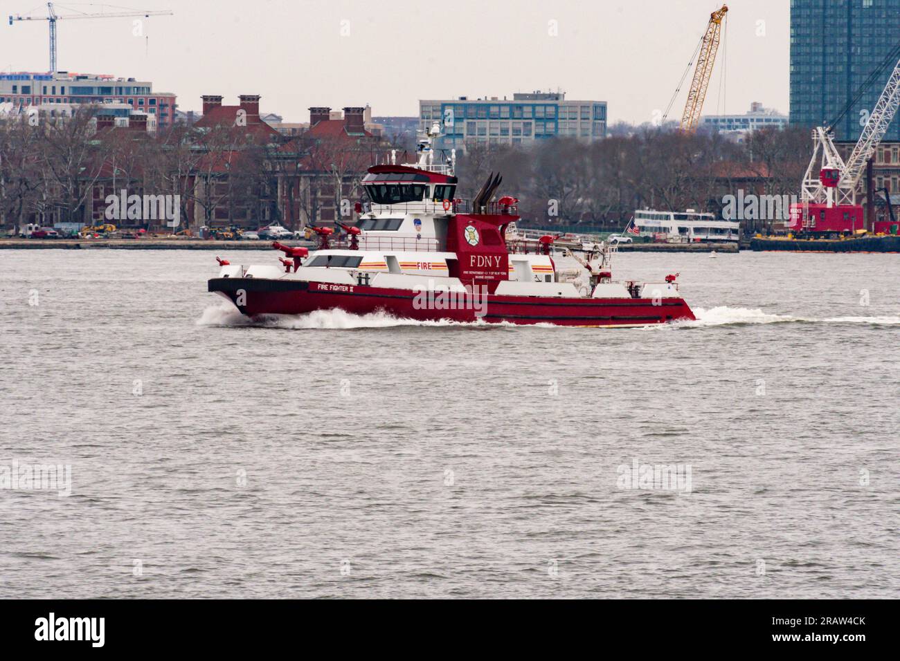 FDNY Fire Boat in front of the Statue of Liberty in New York Harbor ...