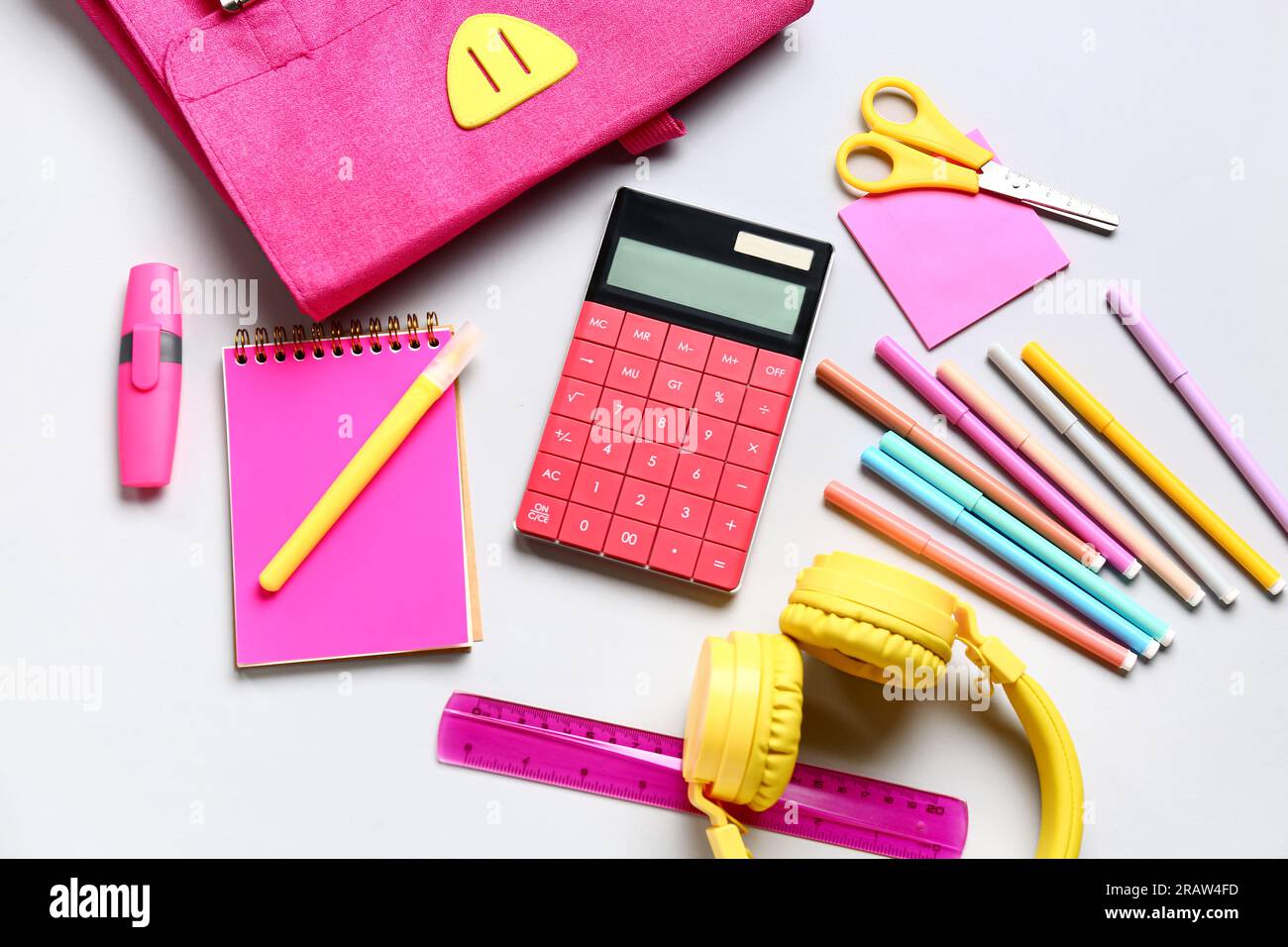 Backpack with calculator, stationery and headphones on white background ...