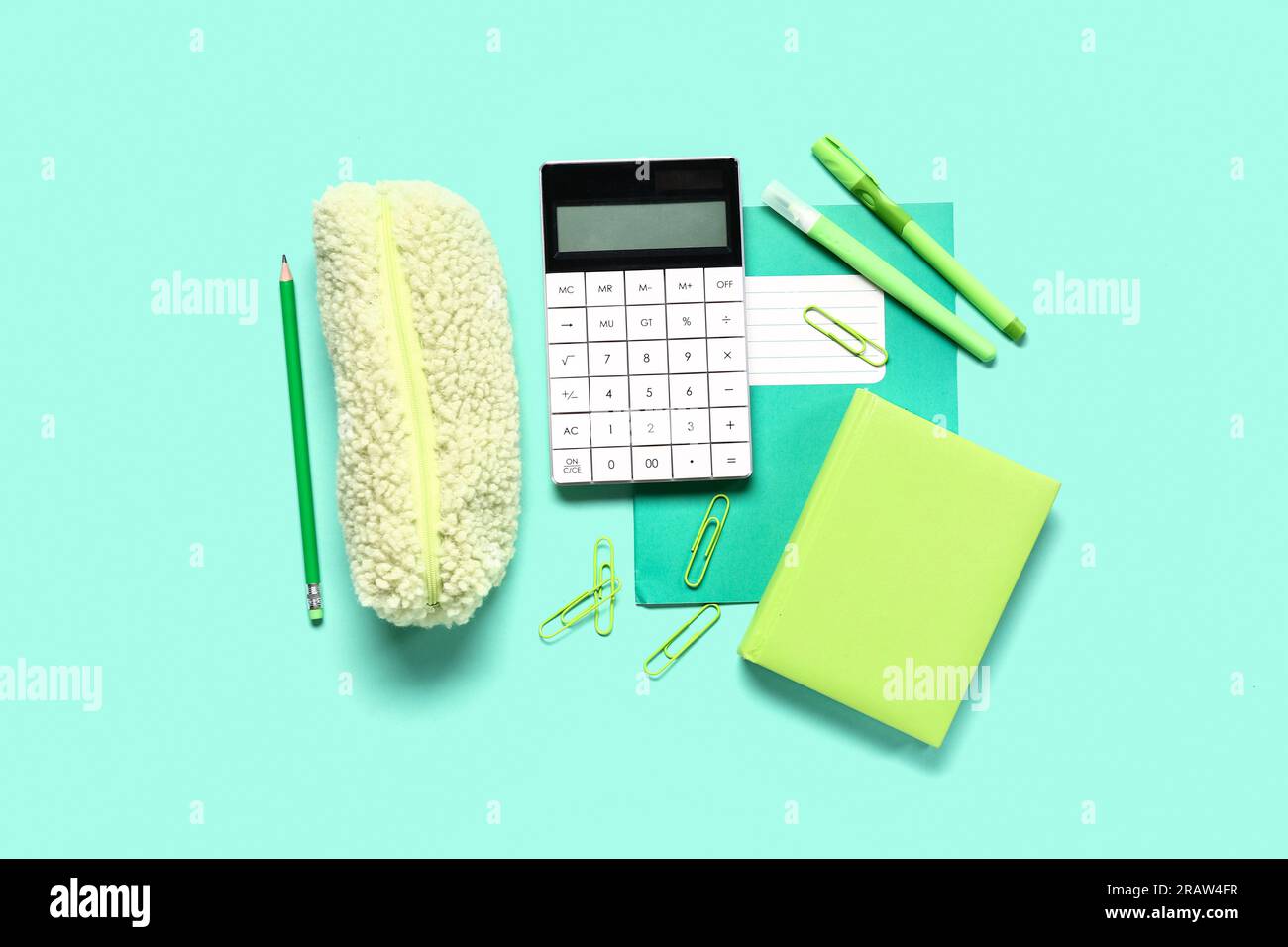 Modern calculator with stationery on turquoise background Stock Photo ...