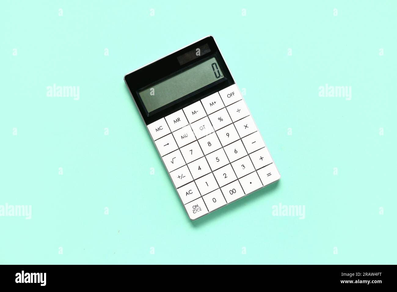 Modern calculator on turquoise background Stock Photo - Alamy