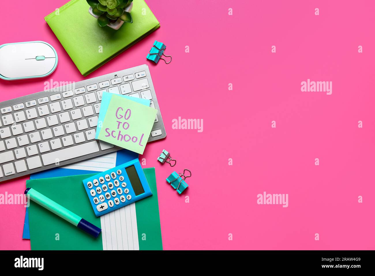 Sticky note with text GO TO SCHOOL, calculator, keyboard and stationery ...