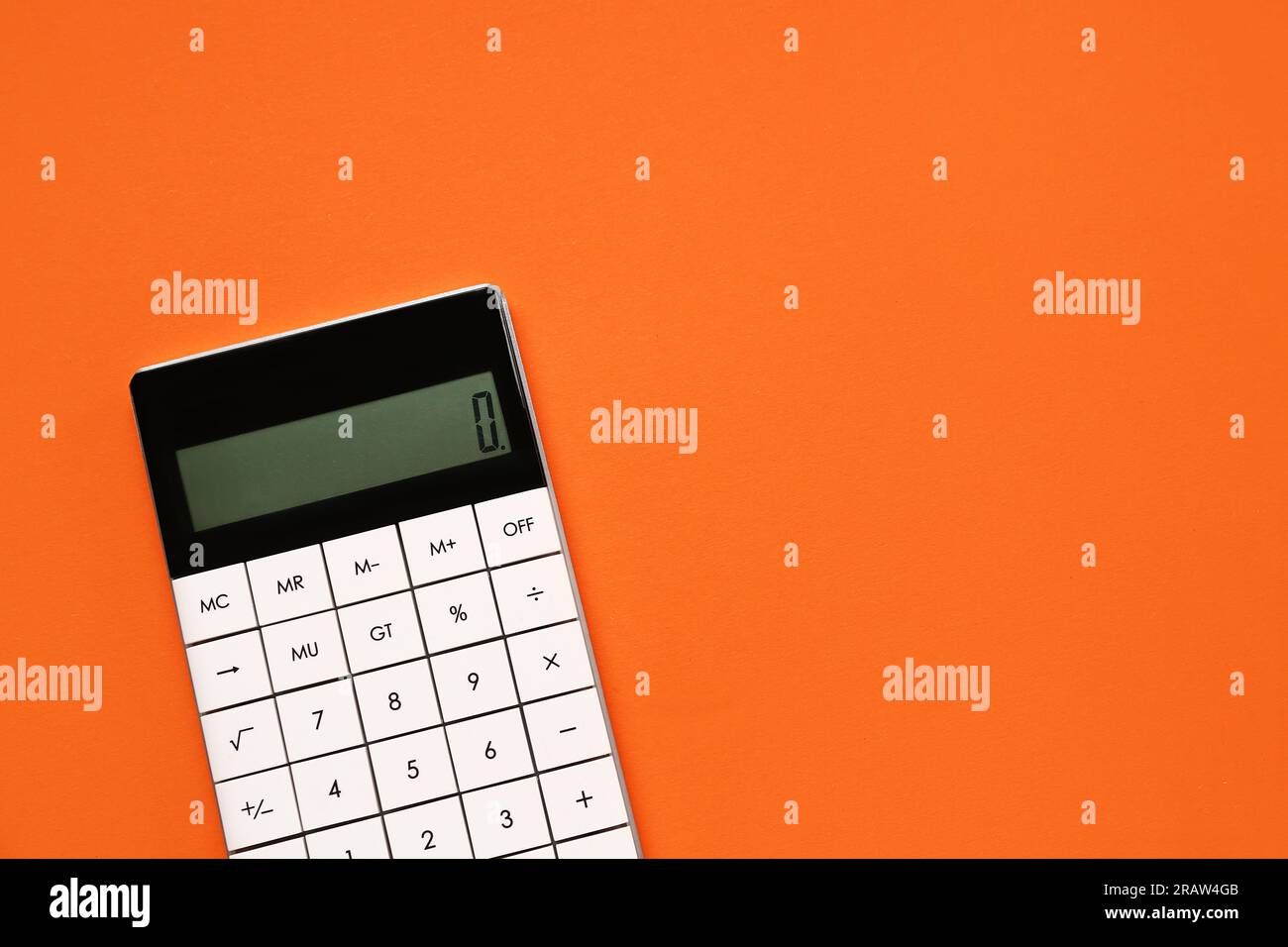 Modern calculator on orange background Stock Photo - Alamy