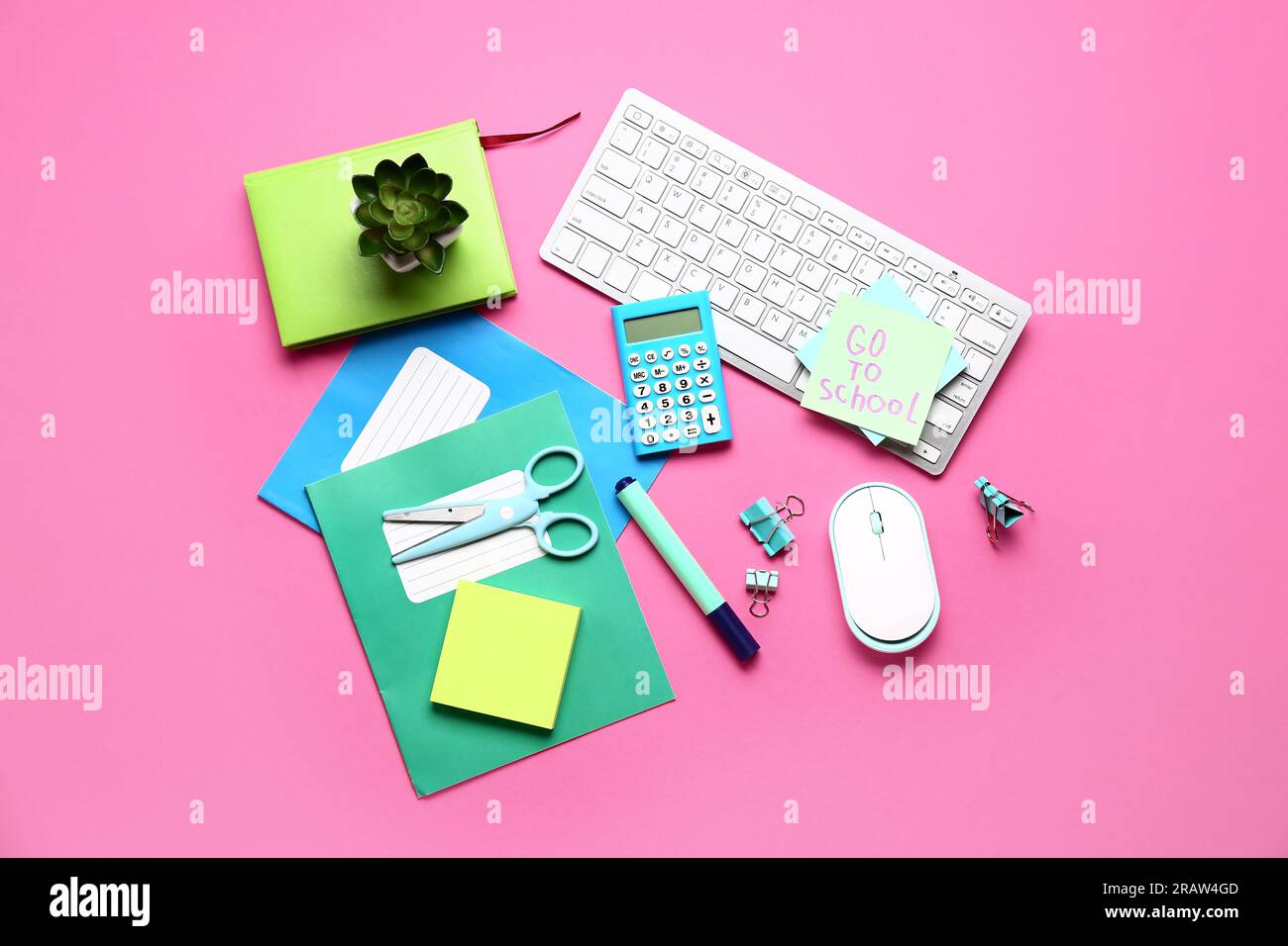 Sticky note with text GO TO SCHOOL, calculator, keyboard and stationery ...