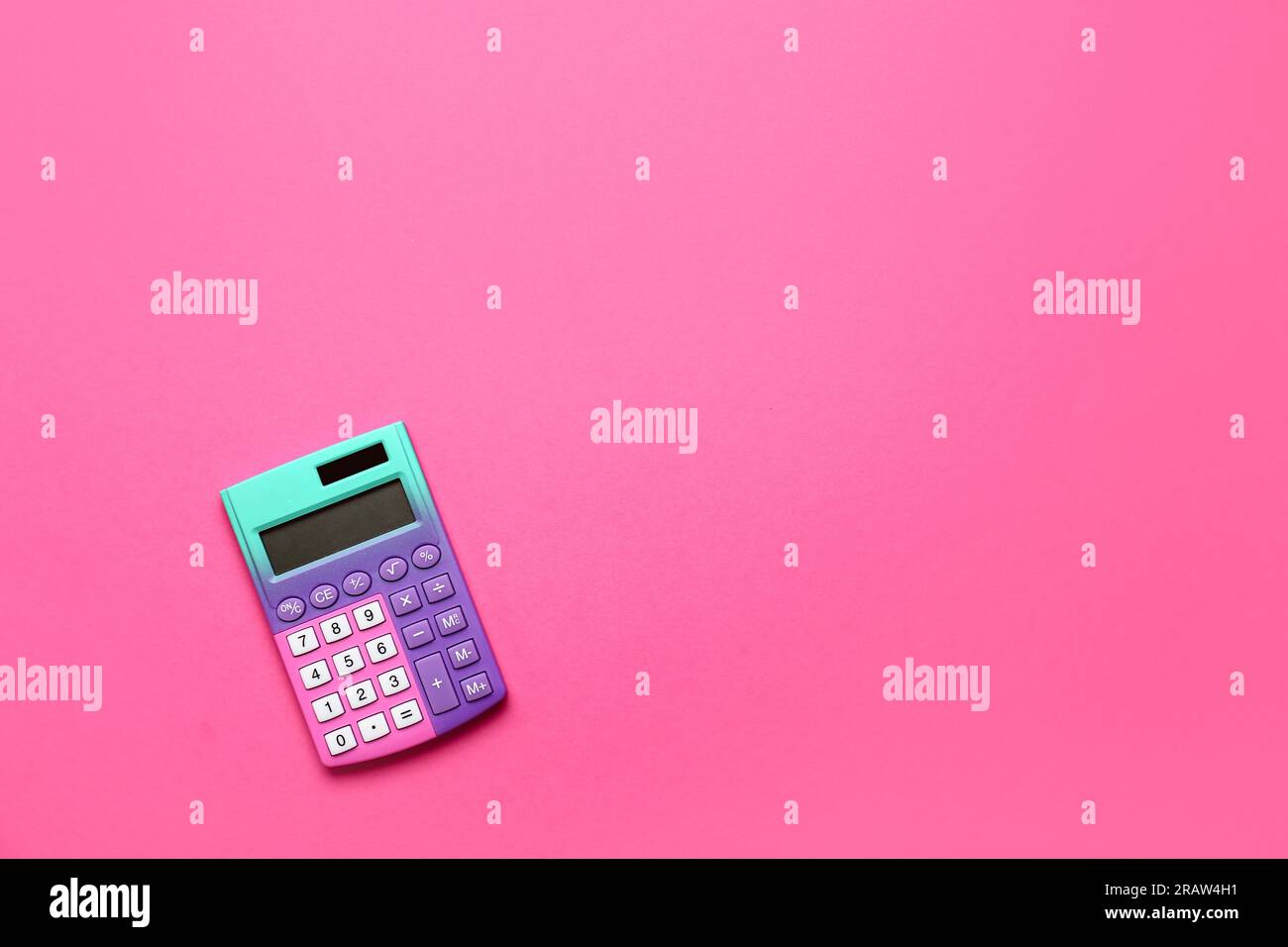 Modern calculator on pink background Stock Photo - Alamy