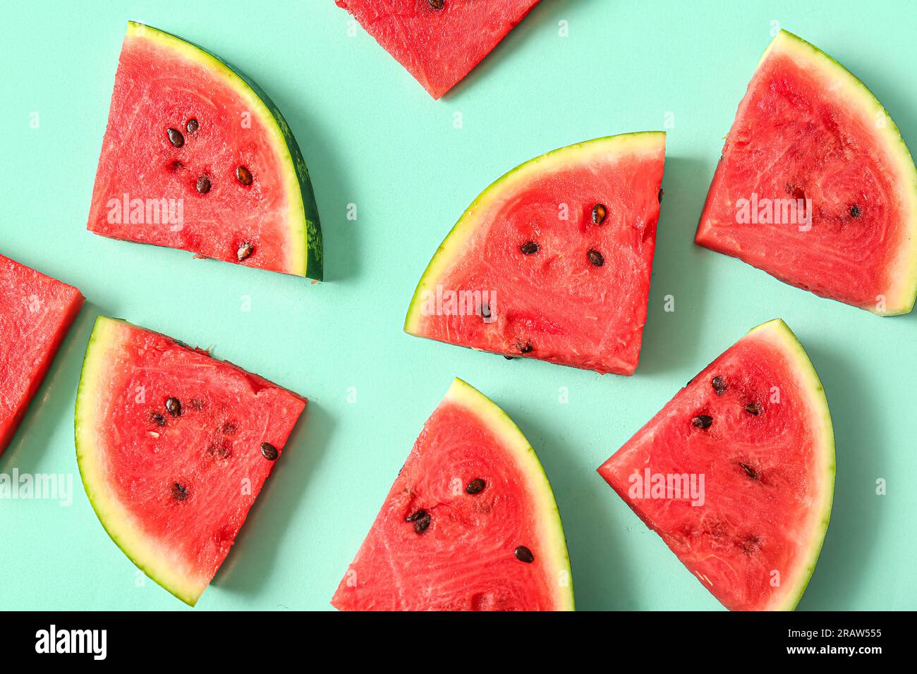 Pieces of fresh watermelon on turquoise background Stock Photo - Alamy