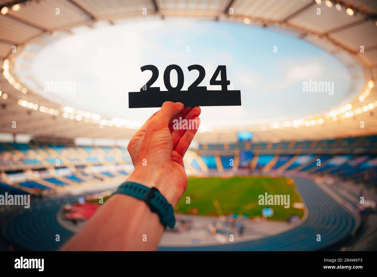 Silhouette of '2024' Holding in hand by Athlete. Sign Signals the Start ...