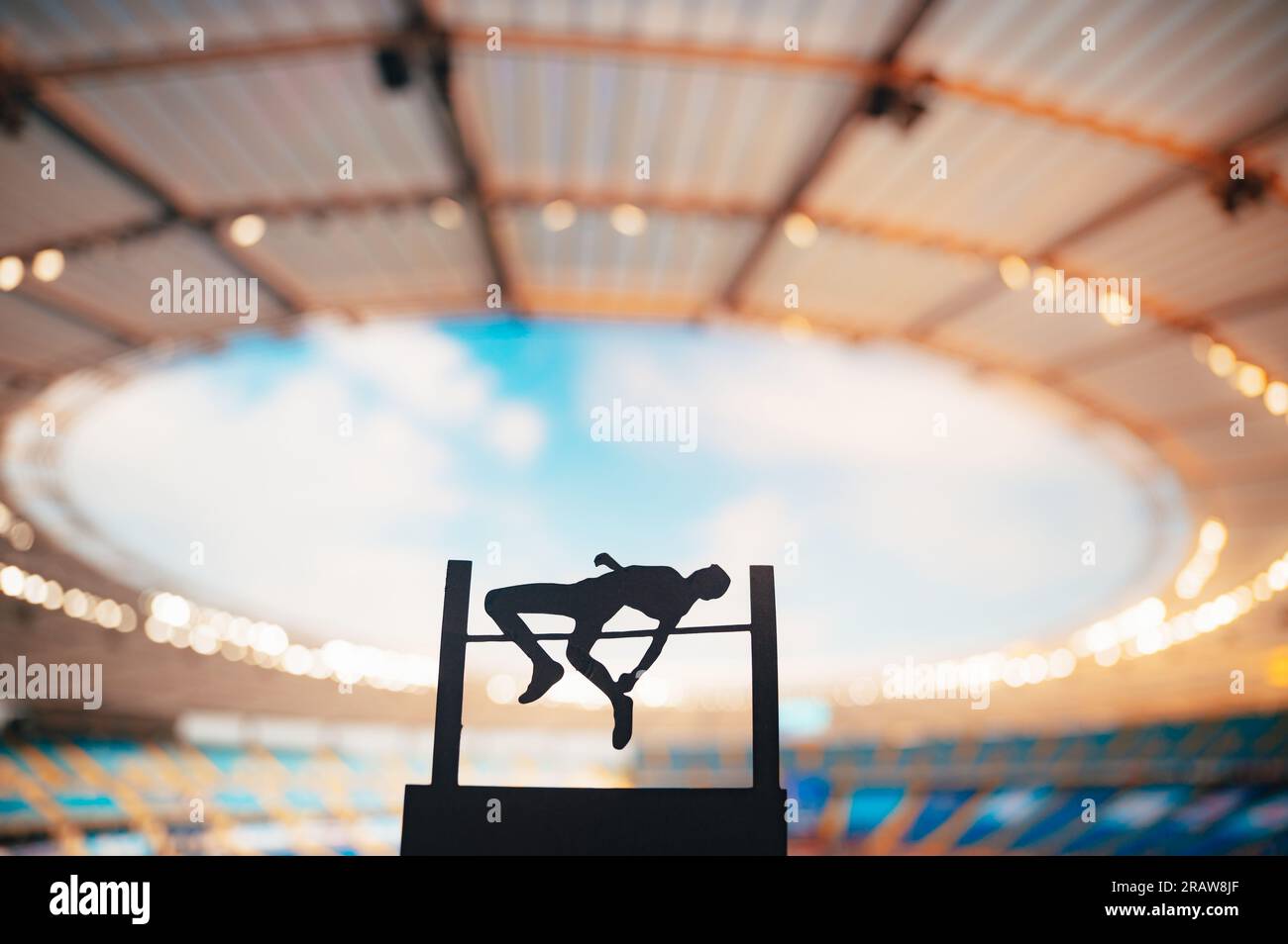 Silhouette of High Jumper Inspiring at Modern Stadium. Photo for Summer ...