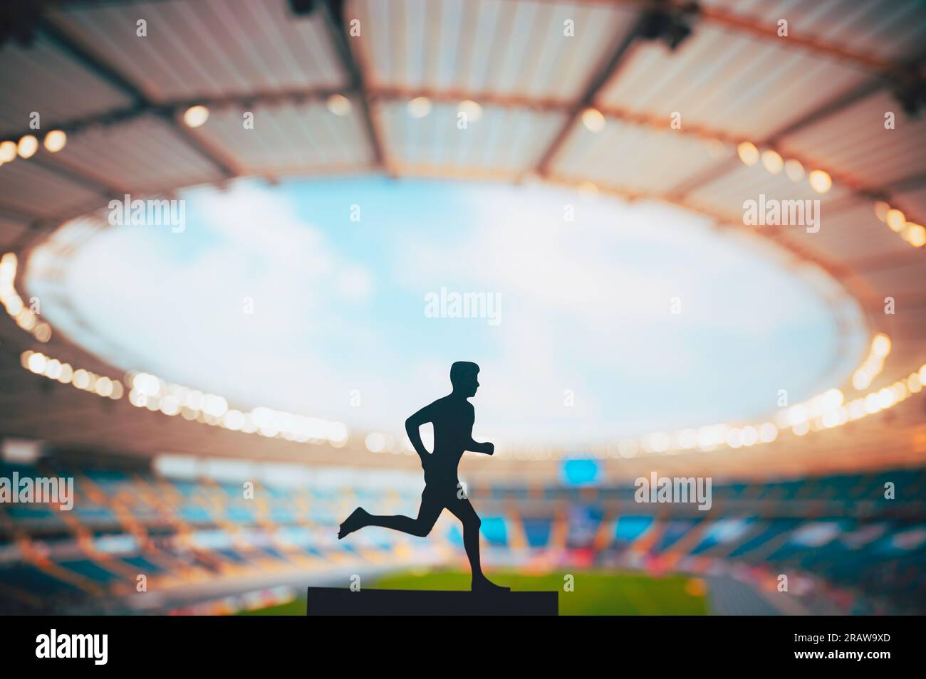 Focused on the Track and Field: Silhouette of a Male Athlete, a ...