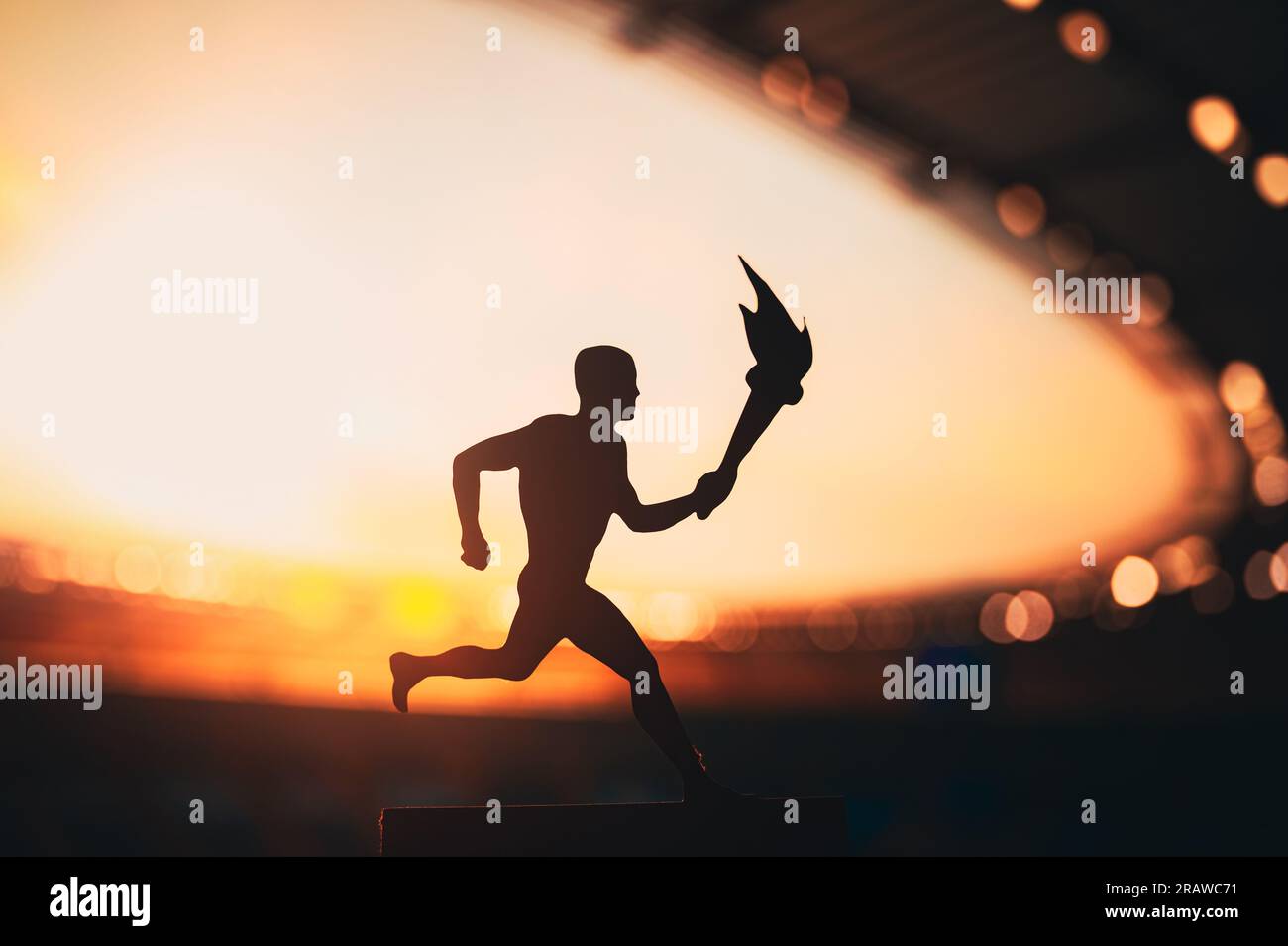 Silhouette of Male Athlete Carrying the Torch Relay, Illuminating the ...