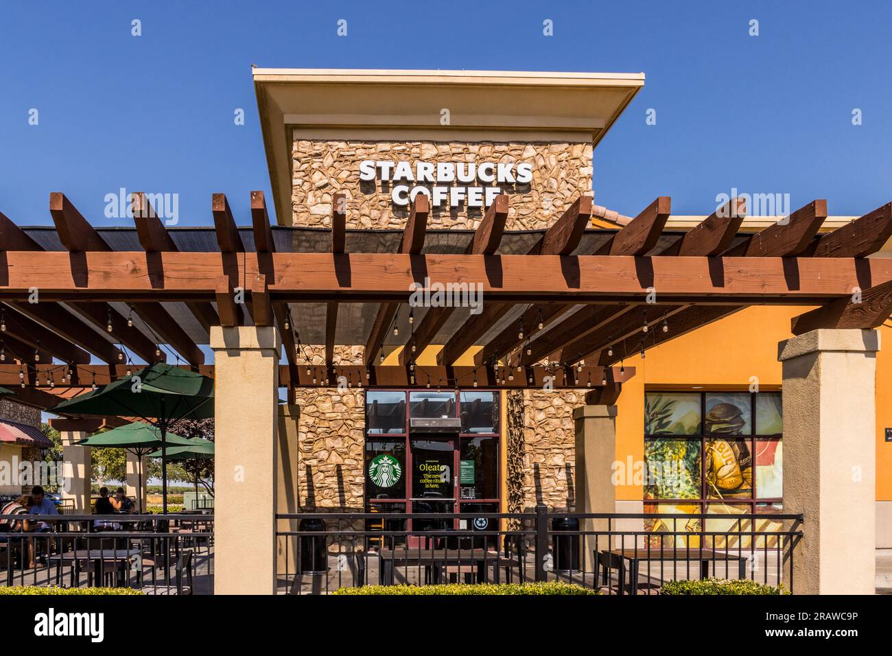A New Starbucks store with outdoor seating in the growing Community of ...