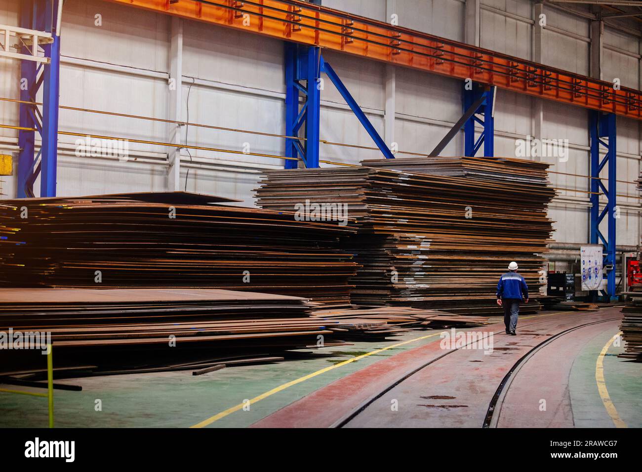 Stack of steel sheets in warehouse Stock Photo - Alamy