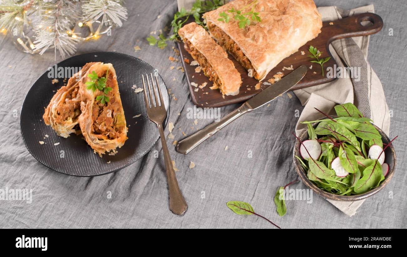 Puff pastry vegetable roll on kitchen decorated countertop Stock Photo ...