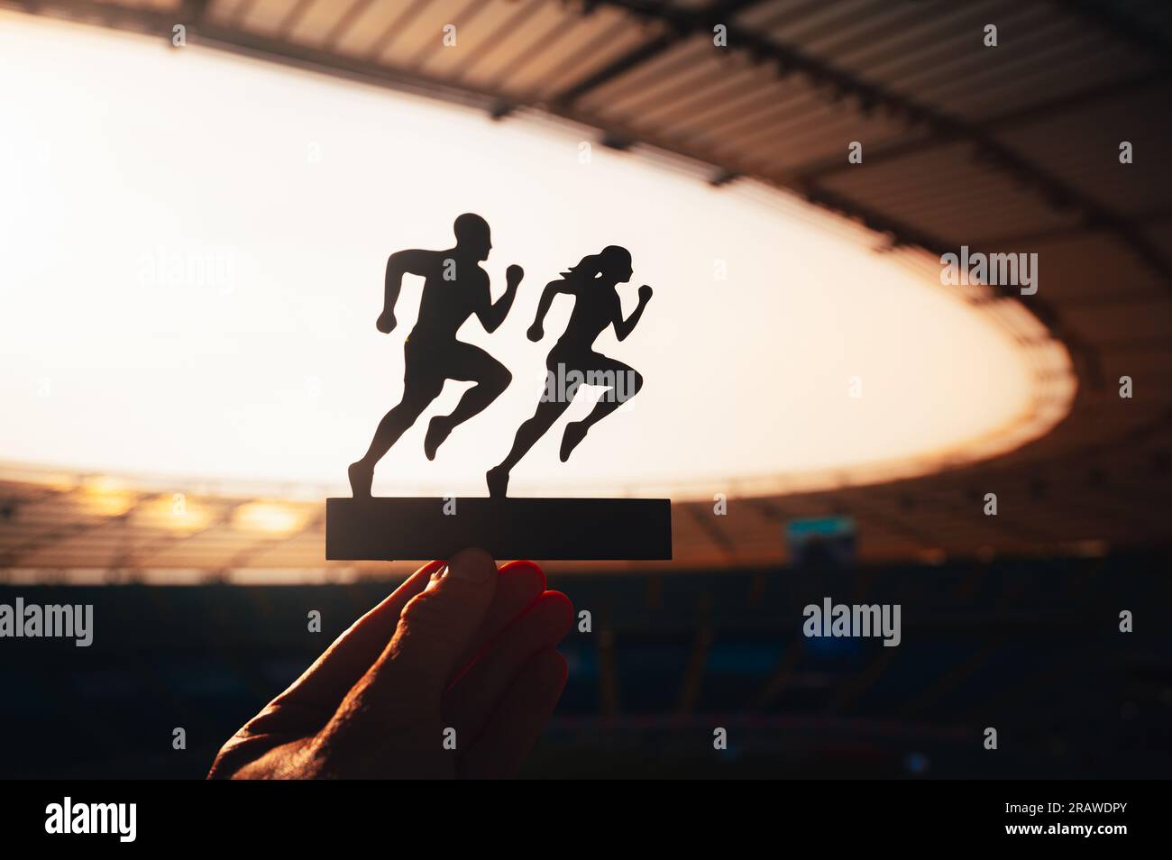 Synchronized Strides: Silhouettes of Male and Female Runners in Tandem ...