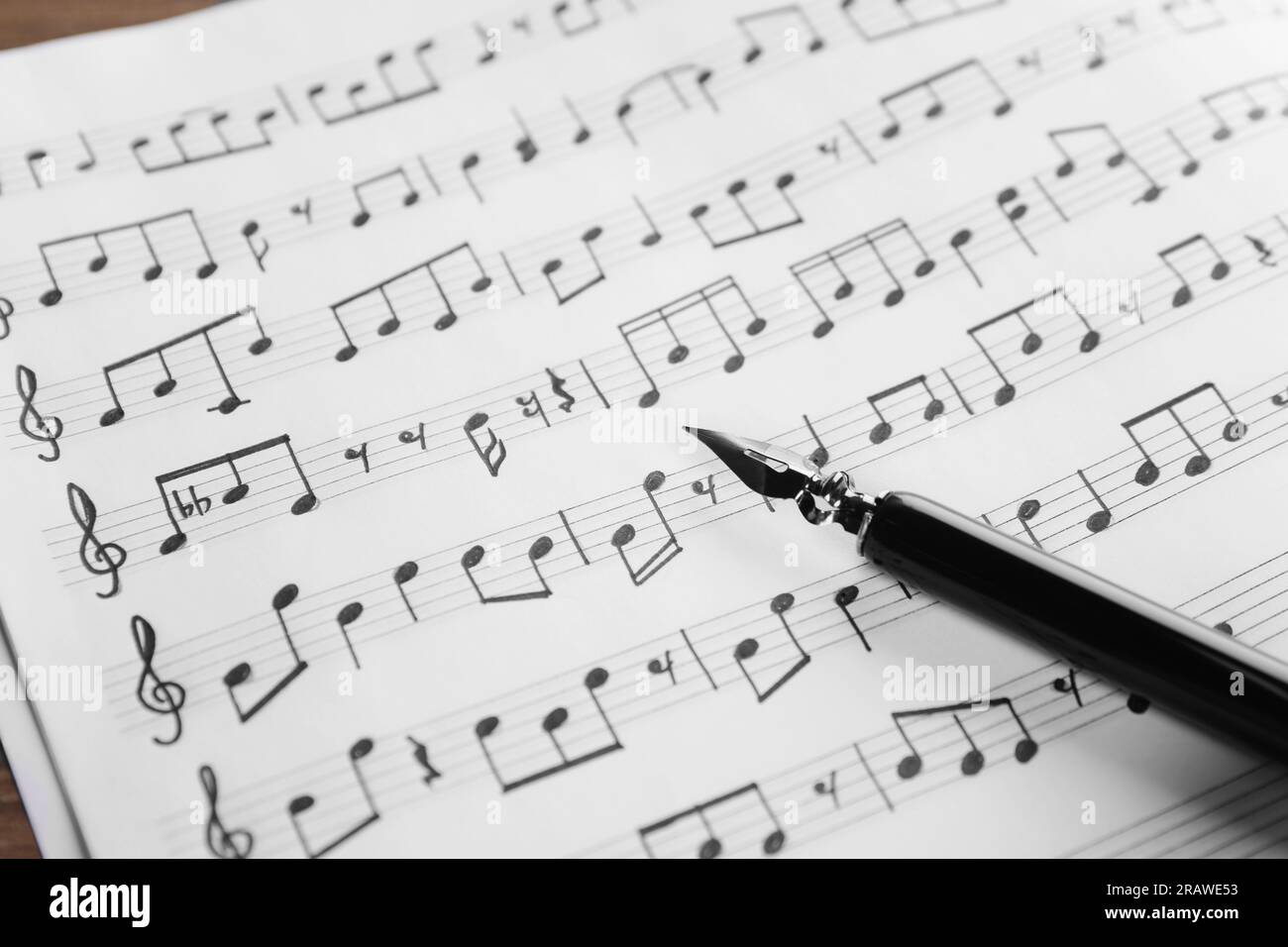 Sheet with musical notes and fountain pen, closeup Stock Photo - Alamy