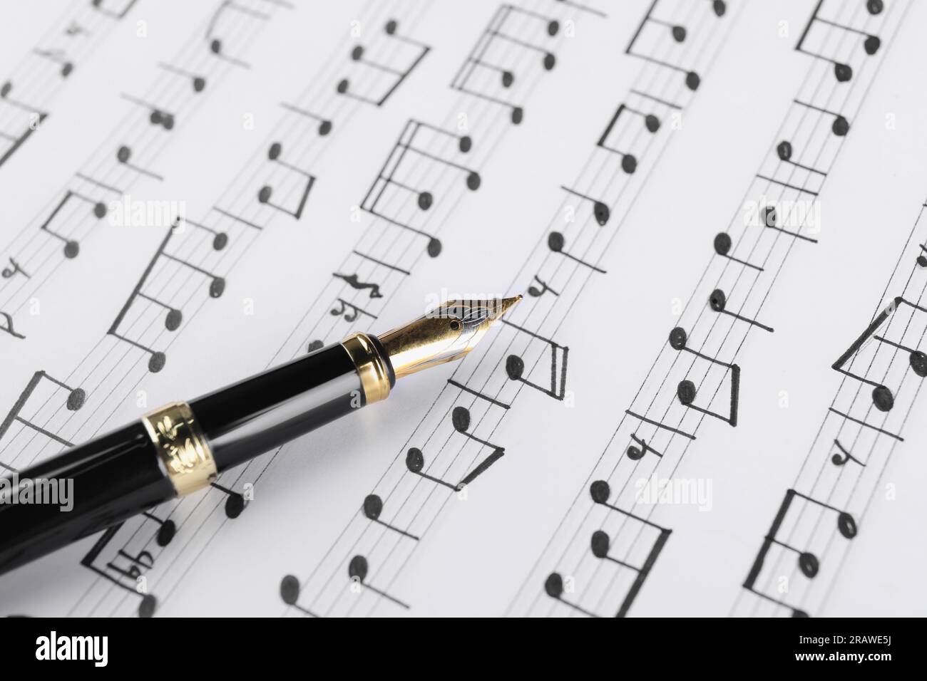 Sheet with musical notes and fountain pen, closeup view Stock Photo - Alamy