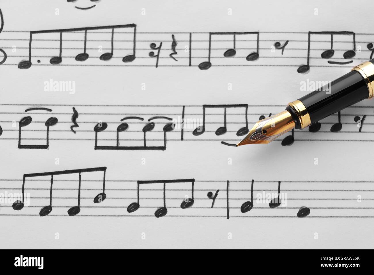 Sheet with musical notes and fountain pen, closeup view Stock Photo - Alamy