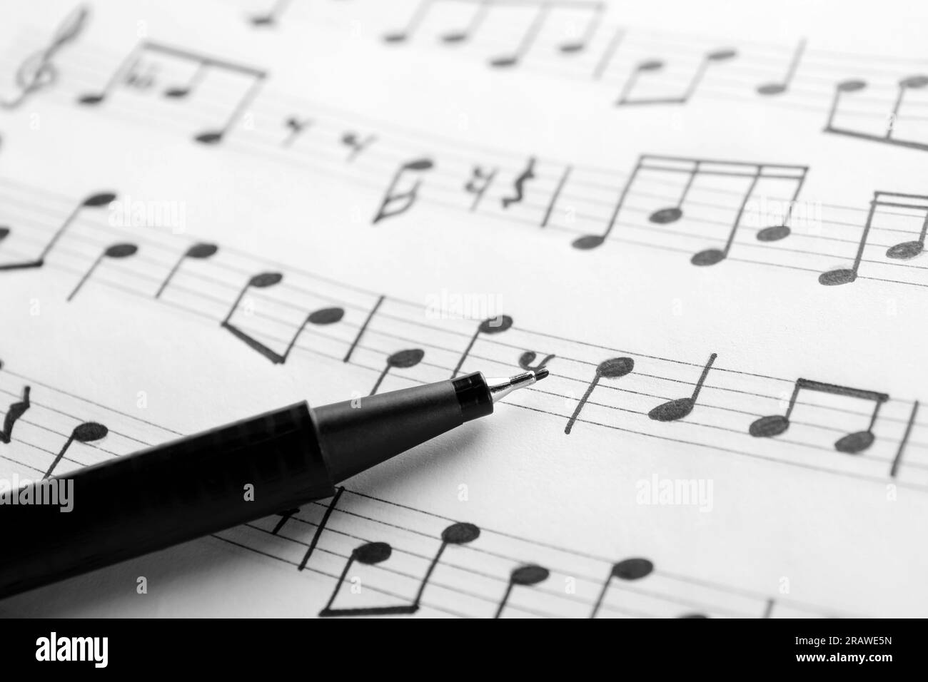 Sheet with musical notes and pen, closeup Stock Photo - Alamy