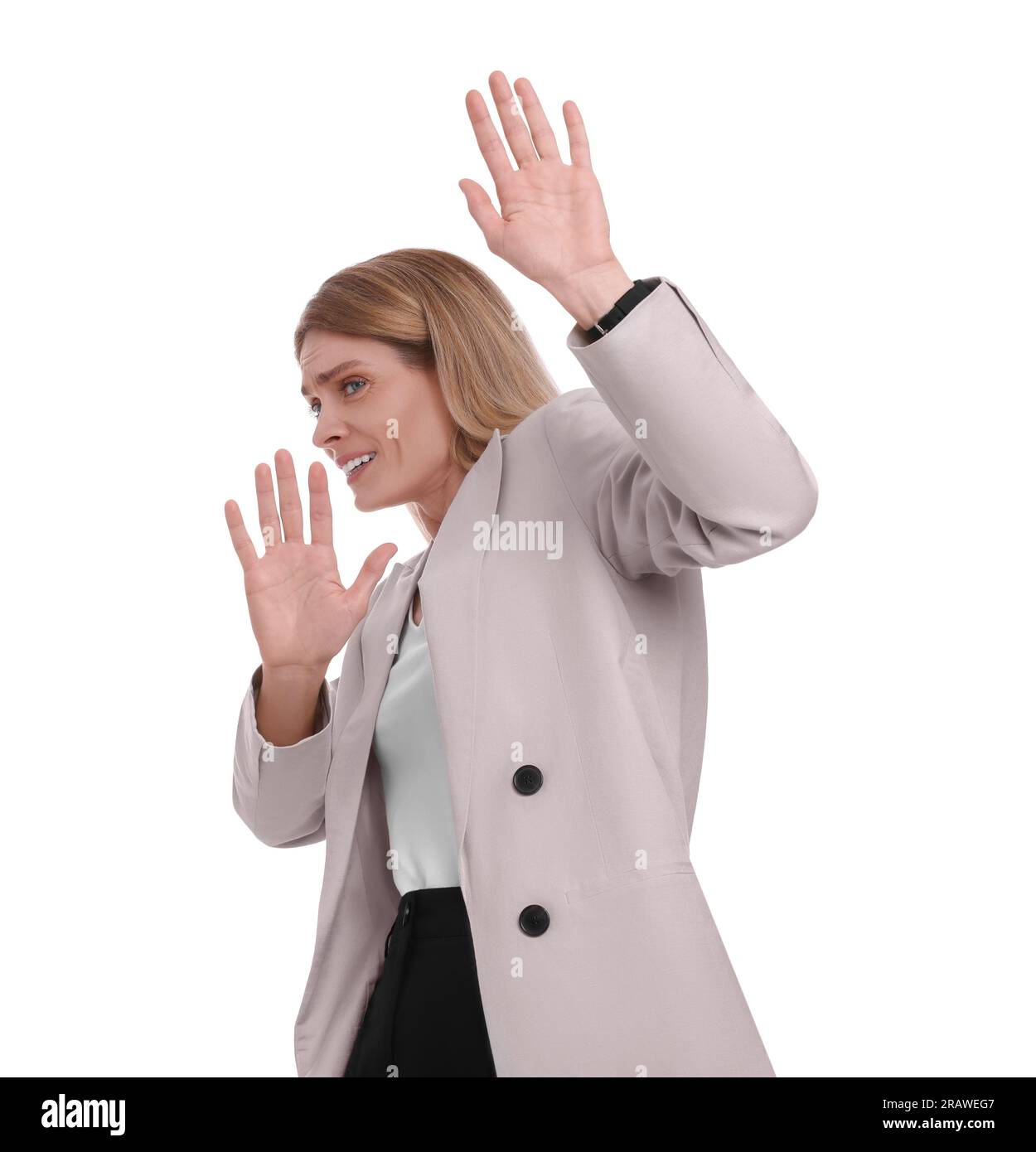 Scared businesswoman avoiding something on white background Stock Photo ...