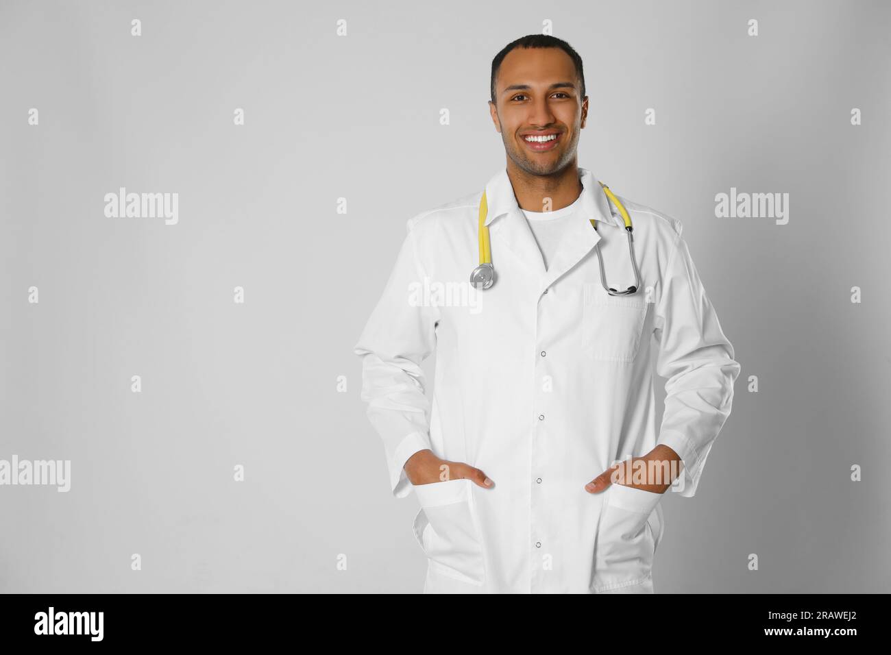 Doctor or medical assistant (male nurse) in uniform with stethoscope on ...