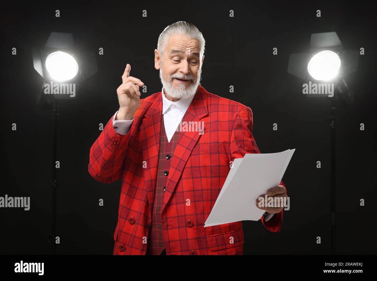 Senior actor with script performing on stage Stock Photo - Alamy