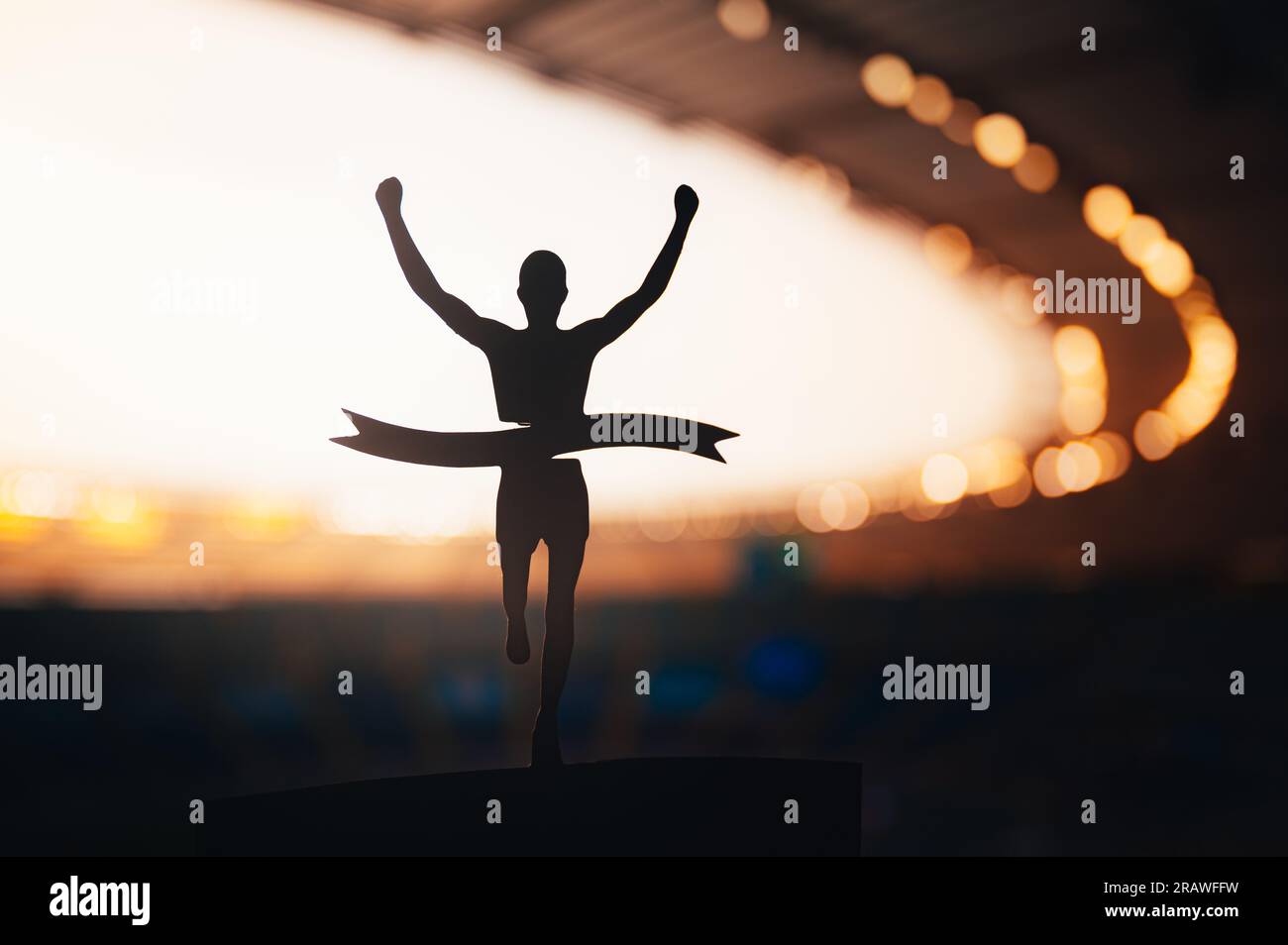 Silhouetted Runner Claims Victory at Modern Athletics Stadium. Edit ...
