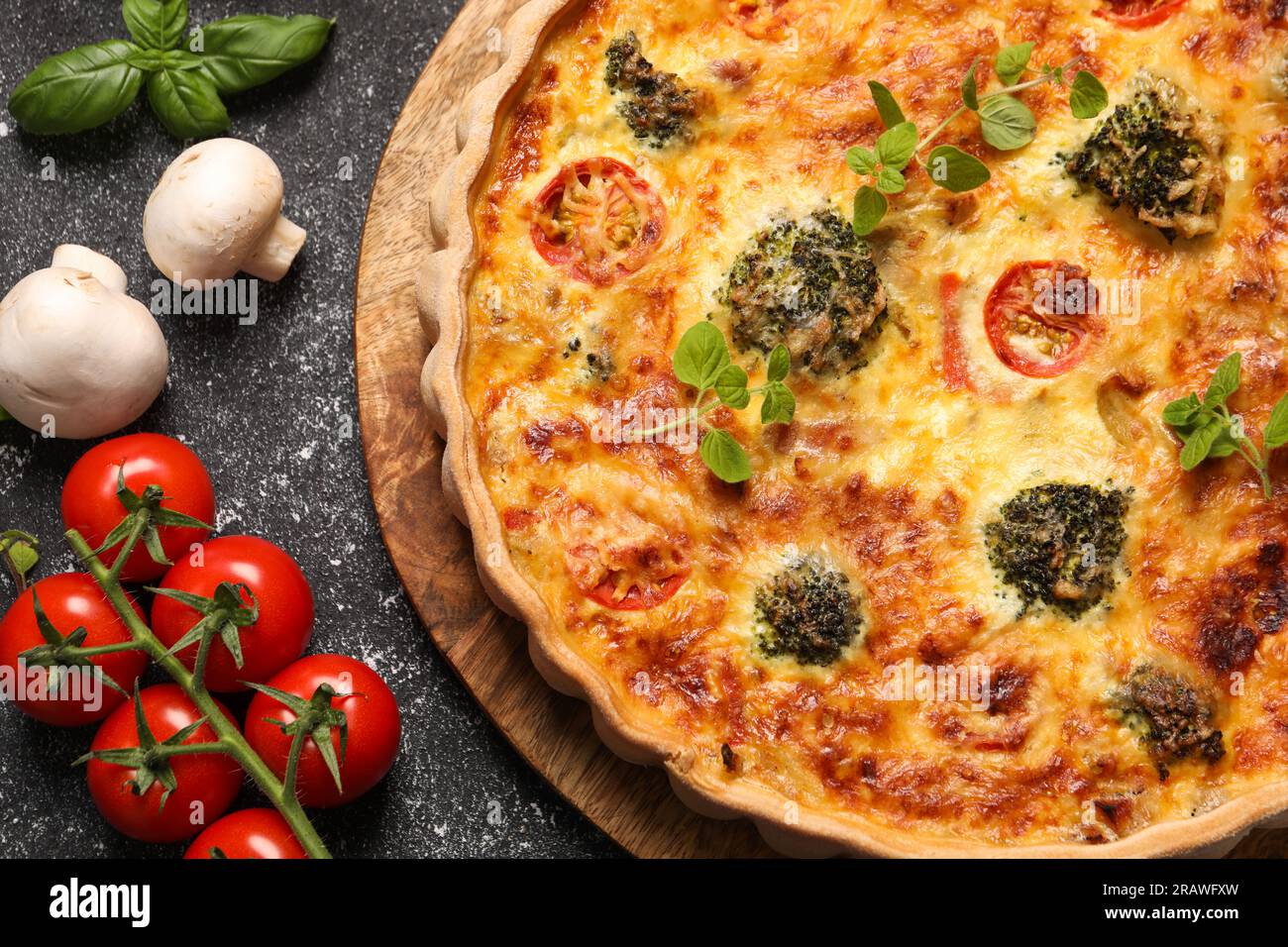 Delicious homemade vegetable quiche, oregano, tomatoes and mushrooms on ...