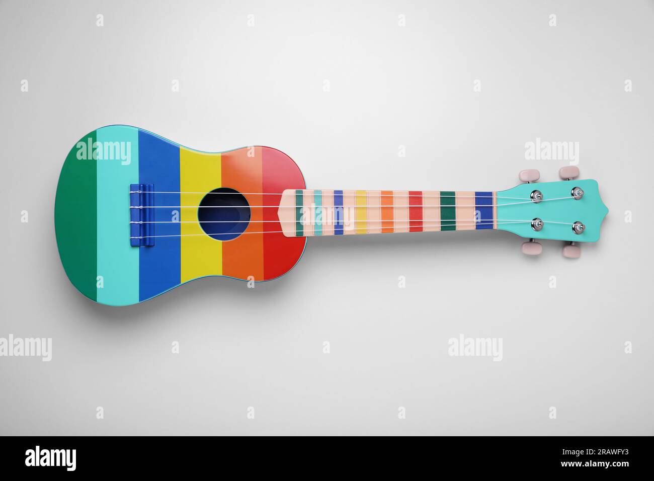 Colorful ukulele on white background, top view. String musical ...