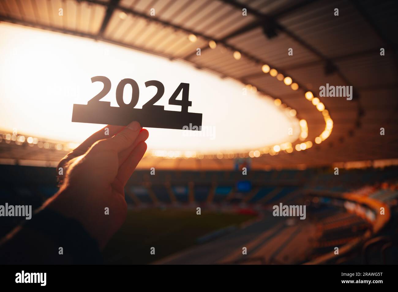 Silhouette of '2024' Holding in hand by Athlete. Sign Signals the Start ...